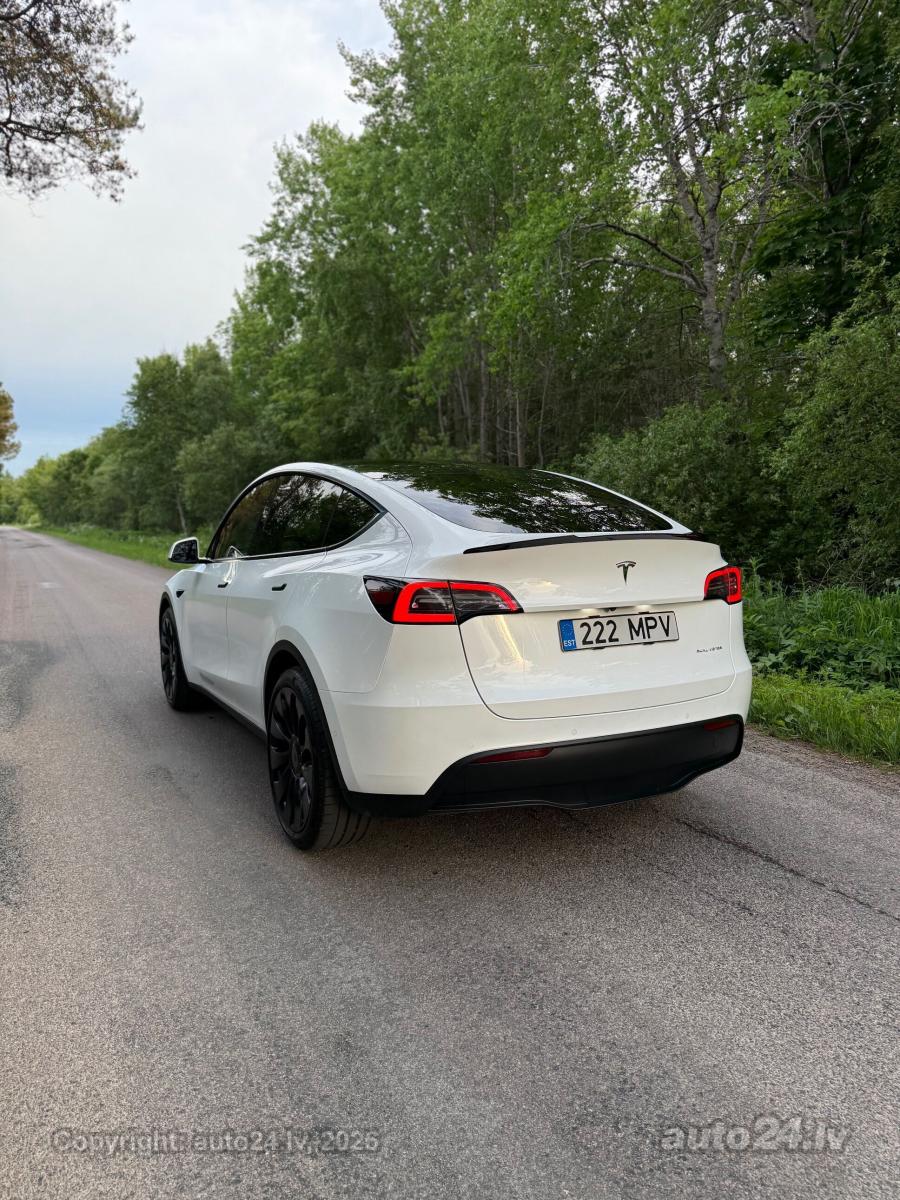 White Tesla Model Y 2022 in Tallinn, with an engine capacity of 0.00 L and mileage of 80 thousand km for 33900 €, photo 5 on AUTOMOTO.COM.LV