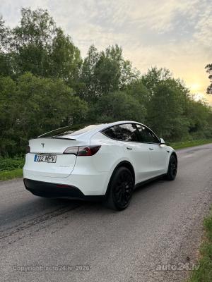 White Tesla Model Y 2022 in Tallinn, with an engine capacity of 0.00 L and mileage of 80 thousand km for 33900 €, photo 6 on AUTOMOTO.COM.LV