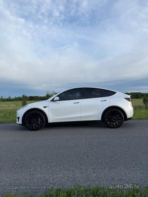 White Tesla Model Y 2022 in Tallinn, with an engine capacity of 0.00 L and mileage of 80 thousand km for 33900 €, photo 7 on AUTOMOTO.COM.LV