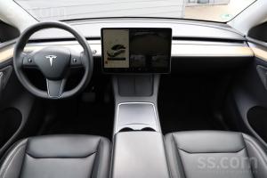 White Tesla Model Y 2022 in Tukums, with an engine capacity of 0.00 L and mileage of 99 thousand km for 32000 €, photo 8 on AUTOMOTO.COM.LV
