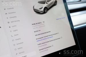 White Tesla Model Y 2022 in Tukums, with an engine capacity of 0.00 L and mileage of 99 thousand km for 32000 €, photo 15 on AUTOMOTO.COM.LV