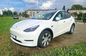 White Tesla Model Y 2022 in Riga, with an engine capacity of 0.00 L and mileage of 145 thousand km for 31460 €, photo  on AUTOMOTO.COM.LV