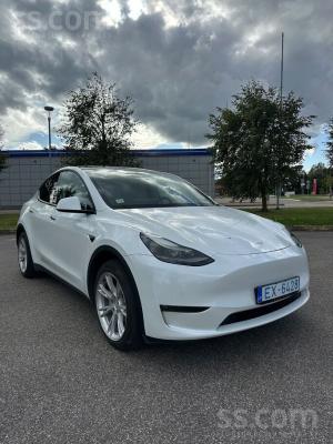 White Tesla Model Y 2022 in Riga, with an engine capacity of 0.00 L and mileage of 85 thousand km for 30000 €, photo  on AUTOMOTO.COM.LV