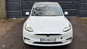 White Tesla Model Y 2023 in Jonava, with an engine capacity of 0.00 L and mileage of 34 thousand km for 15750 €, photo 2 on AUTOMOTO.COM.LV