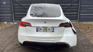White Tesla Model Y 2023 in Jonava, with an engine capacity of 0.00 L and mileage of 34 thousand km for 15750 €, photo 14 on AUTOMOTO.COM.LV