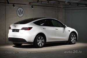 White Tesla Model Y 2023 in Tallinn, with an engine capacity of 0.00 L and mileage of 75 thousand km for 35990 €, photo 3 on AUTOMOTO.COM.LV