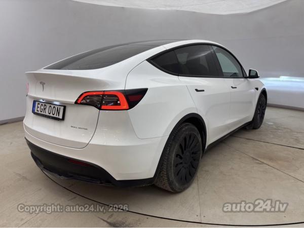 White Tesla Model Y 2023 in Tallinn, with an engine capacity of 0.00 L and mileage of 83 thousand km for 36490 €, photo 3 on AUTOMOTO.COM.LV