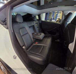 White Tesla Model Y 2023 in Tartu, with an engine capacity of 0.00 L and mileage of 118 thousand km for 33990 €, photo 9 on AUTOMOTO.COM.LV