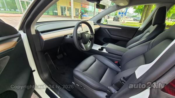 White Tesla Model Y 2023 in Tallinn, with an engine capacity of 0.00 L and mileage of 52 thousand km for 36990 €, photo 8 on AUTOMOTO.COM.LV