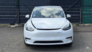 White Tesla Model Y 2023 in Jonava, with an engine capacity of 0.00 L and mileage of 70 thousand km for 15950 €, photo 11 on AUTOMOTO.COM.LV