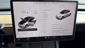 White Tesla Model Y 2023 in Jonava, with an engine capacity of 0.00 L and mileage of 70 thousand km for 15950 €, photo 23 on AUTOMOTO.COM.LV