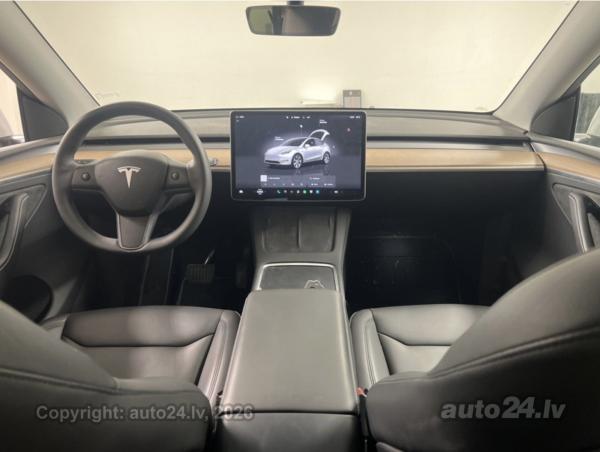 White Tesla Model Y 2023 in Tallinn, with an engine capacity of 0.00 L and mileage of 49 thousand km for 38990 €, photo 5 on AUTOMOTO.COM.LV