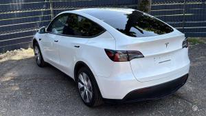White Tesla Model Y 2023 in Jonava, with an engine capacity of 0.00 L and mileage of 70 thousand km for 16900 €, photo 16 on AUTOMOTO.COM.LV