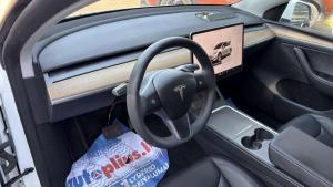 White Tesla Model Y 2023 in Jonava, with an engine capacity of 0.00 L and mileage of 70 thousand km for 16900 €, photo 22 on AUTOMOTO.COM.LV