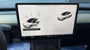 White Tesla Model Y 2023 in Jonava, with an engine capacity of 0.00 L and mileage of 70 thousand km for 16900 €, photo 23 on AUTOMOTO.COM.LV