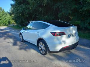 White Tesla Model Y 2023 in Tartu, with an engine capacity of 0.00 L and mileage of 29 thousand km for 35200 €, photo 3 on AUTOMOTO.COM.LV