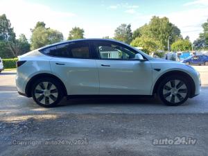 White Tesla Model Y 2023 in Tartu, with an engine capacity of 0.00 L and mileage of 29 thousand km for 35200 €, photo 6 on AUTOMOTO.COM.LV