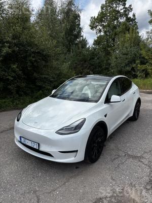 White Tesla Model Y 2023 in Riga, with an engine capacity of 0.00 L and mileage of 75 thousand km for 39400 €, photo  on AUTOMOTO.COM.LV