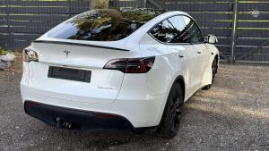 White Tesla Model Y 2023 in Jonava, with an engine capacity of 0.00 L and mileage of 138 thousand km for 23500 €, photo 6 on AUTOMOTO.COM.LV