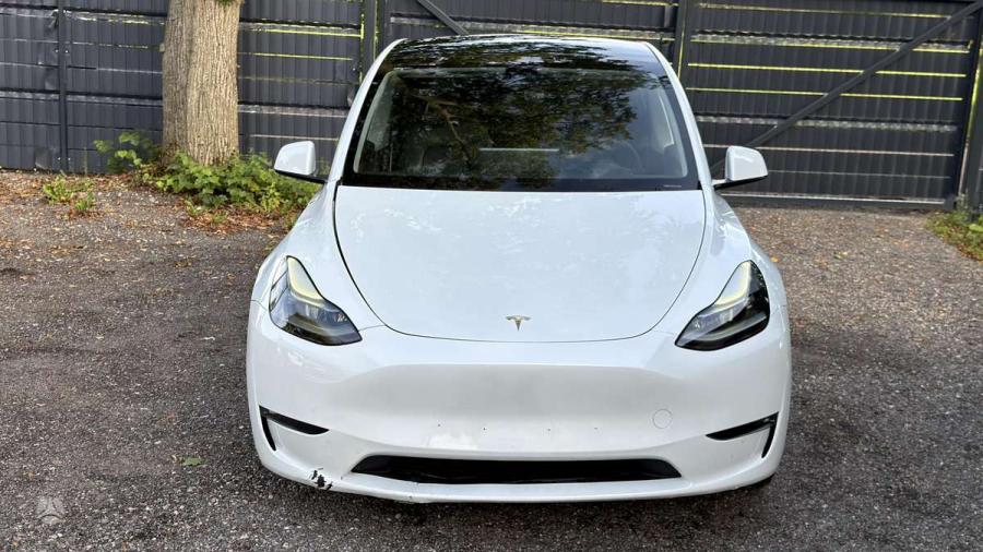 White Tesla Model Y 2023 in Jonava, with an engine capacity of 0.00 L and mileage of 138 thousand km for 23500 €, photo 11 on AUTOMOTO.COM.LV