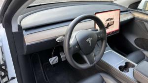 White Tesla Model Y 2023 in Jonava, with an engine capacity of 0.00 L and mileage of 138 thousand km for 23500 €, photo 25 on AUTOMOTO.COM.LV