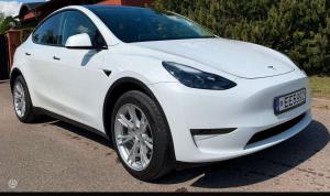 White Tesla Model Y 2024 in Vilnius, with an engine capacity of 0.00 L and mileage of 54 thousand km for 38950 €, photo  on AUTOMOTO.COM.LV