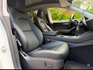 White Tesla Model Y 2024 in Vilnius, with an engine capacity of 0.00 L and mileage of 54 thousand km for 38950 €, photo 14 on AUTOMOTO.COM.LV
