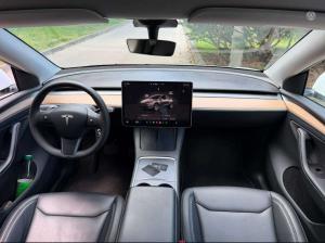 White Tesla Model Y 2024 in Vilnius, with an engine capacity of 0.00 L and mileage of 54 thousand km for 38950 €, photo 15 on AUTOMOTO.COM.LV