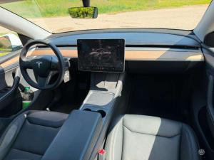 White Tesla Model Y 2024 in Vilnius, with an engine capacity of 0.00 L and mileage of 54 thousand km for 38950 €, photo 16 on AUTOMOTO.COM.LV
