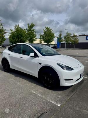 White Tesla Model Y 2022 in Klaipeda, with an engine capacity of 0.00 L and mileage of 69 thousand km for 28600 €, photo 5 on AUTOMOTO.COM.LV