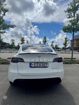 White Tesla Model Y 2022 in Klaipeda, with an engine capacity of 0.00 L and mileage of 69 thousand km for 28600 €, photo 8 on AUTOMOTO.COM.LV
