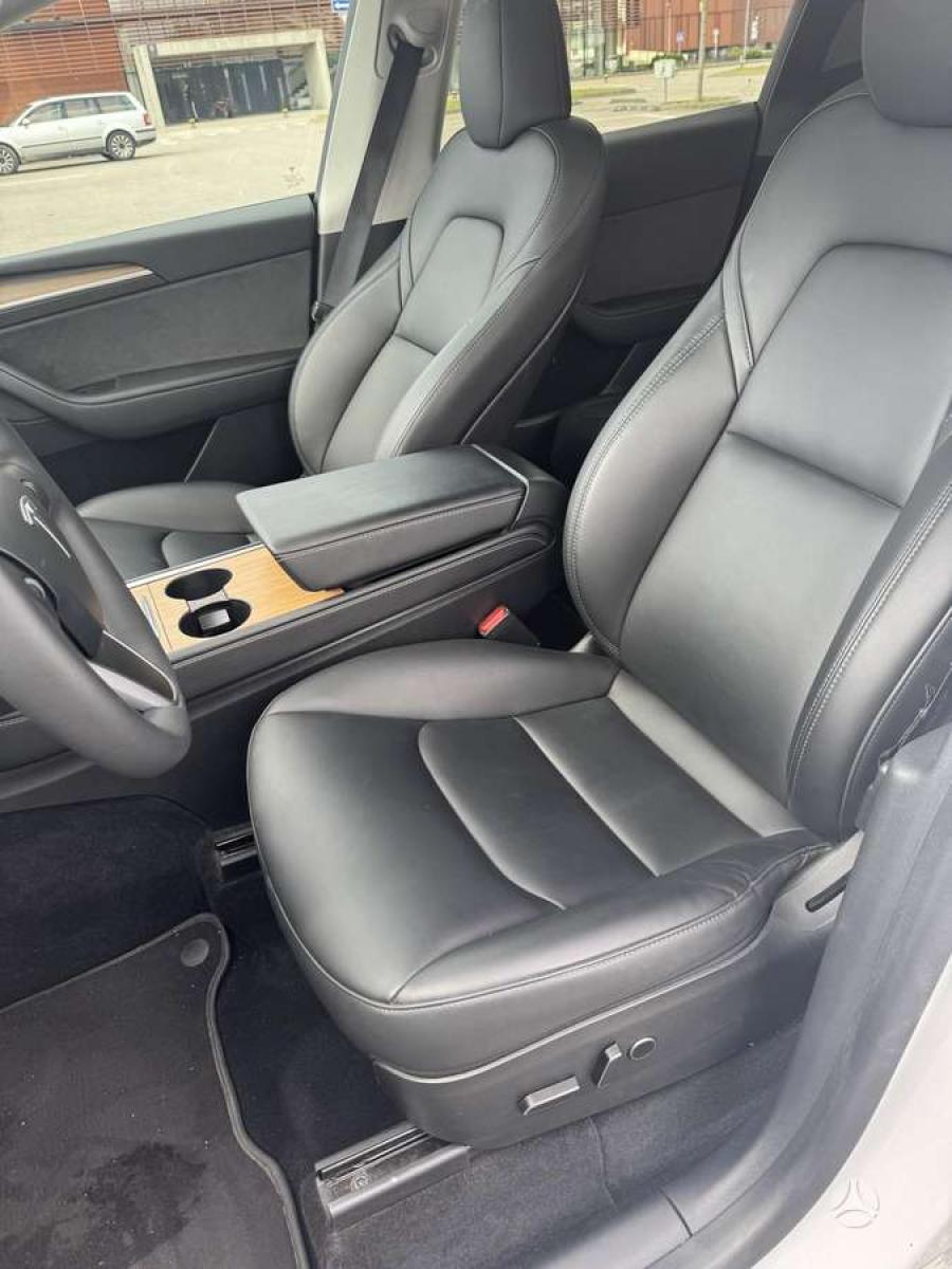 White Tesla Model Y 2022 in Klaipeda, with an engine capacity of 0.00 L and mileage of 69 thousand km for 28600 €, photo 14 on AUTOMOTO.COM.LV