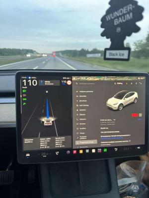 White Tesla Model Y 2022 in Klaipeda, with an engine capacity of 0.00 L and mileage of 69 thousand km for 28600 €, photo 17 on AUTOMOTO.COM.LV