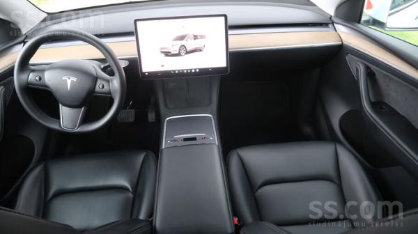 White Tesla Model Y 2022 in Riga, with an engine capacity of 0.00 L and mileage of 106 thousand km for 28900 €, photo 10 on AUTOMOTO.COM.LV