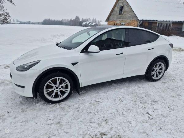 White Tesla Model Y 2023 in Marijampole, with an engine capacity of 0.00 L and mileage of 71 thousand km for 19600 €, photo 1 on AUTOMOTO.COM.LV