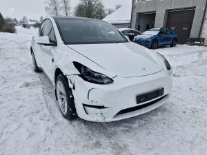 White Tesla Model Y 2023 in Marijampole, with an engine capacity of 0.00 L and mileage of 71 thousand km for 19600 €, photo 2 on AUTOMOTO.COM.LV