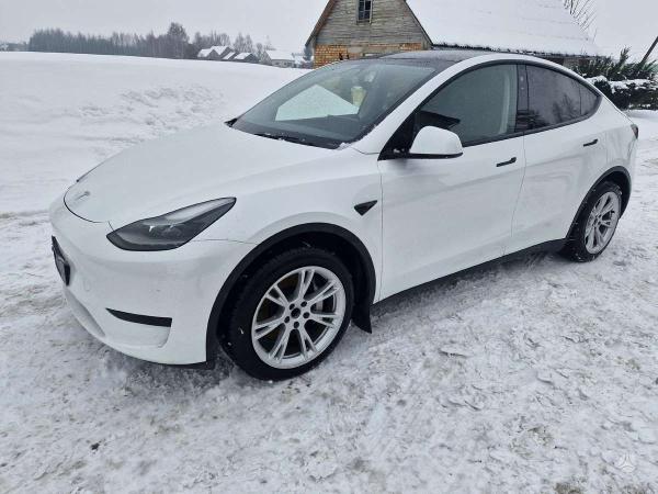 White Tesla Model Y 2023 in Marijampole, with an engine capacity of 0.00 L and mileage of 71 thousand km for 19600 €, photo 3 on AUTOMOTO.COM.LV