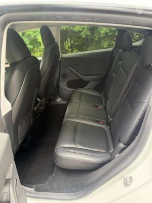 White Tesla Model Y 2023 in Marijampole, with an engine capacity of 0.00 L and mileage of 105 thousand km for 29040 €, photo 13 on AUTOMOTO.COM.LV