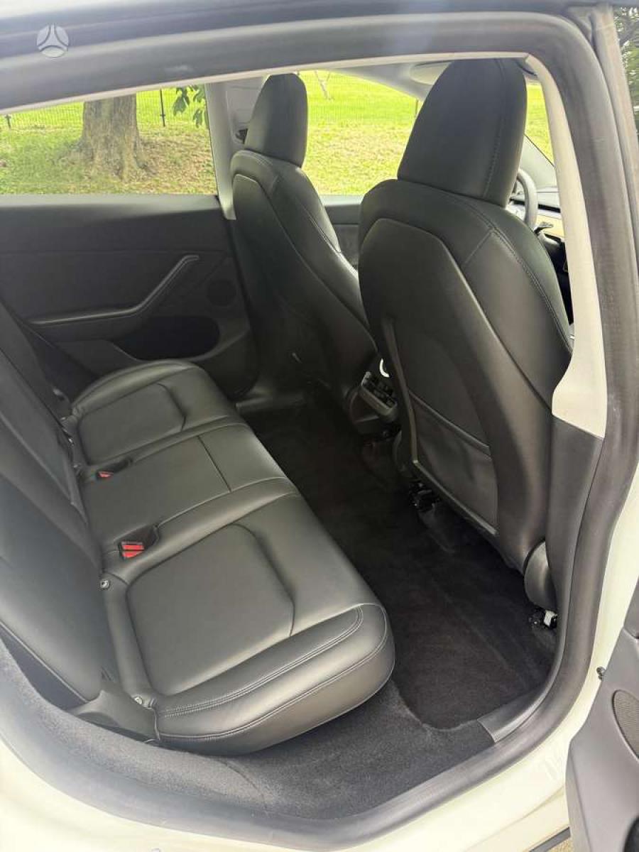 White Tesla Model Y 2023 in Marijampole, with an engine capacity of 0.00 L and mileage of 105 thousand km for 29040 €, photo 15 on AUTOMOTO.COM.LV
