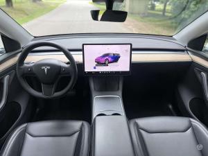 White Tesla Model Y 2023 in Marijampole, with an engine capacity of 0.00 L and mileage of 105 thousand km for 29040 €, photo 17 on AUTOMOTO.COM.LV