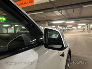 White Tesla Model Y 2021 in Tallinn, with an engine capacity of 0.00 L and mileage of 72 thousand km for 33000 €, photo 4 on AUTOMOTO.COM.LV