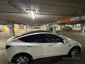 White Tesla Model Y 2021 in Tallinn, with an engine capacity of 0.00 L and mileage of 72 thousand km for 33000 €, photo 5 on AUTOMOTO.COM.LV