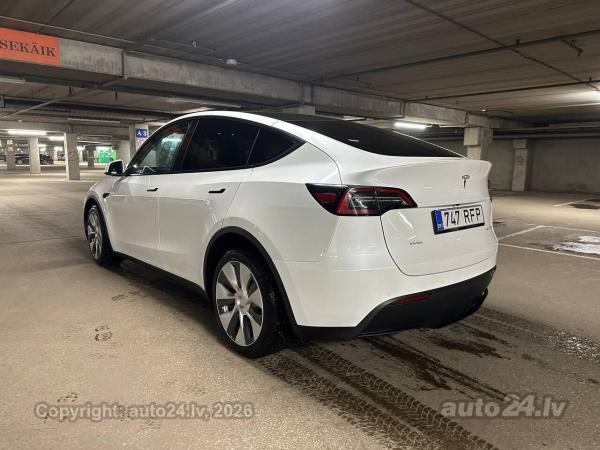 White Tesla Model Y 2021 in Tallinn, with an engine capacity of 0.00 L and mileage of 72 thousand km for 33000 €, photo 7 on AUTOMOTO.COM.LV
