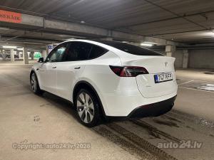 White Tesla Model Y 2021 in Tallinn, with an engine capacity of 0.00 L and mileage of 72 thousand km for 33000 €, photo 8 on AUTOMOTO.COM.LV