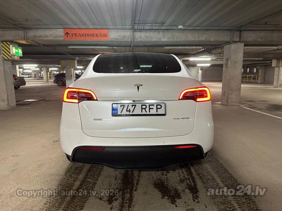 White Tesla Model Y 2021 in Tallinn, with an engine capacity of 0.00 L and mileage of 72 thousand km for 33000 €, photo 9 on AUTOMOTO.COM.LV