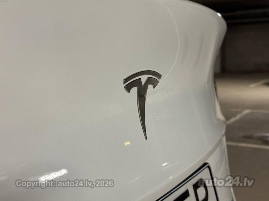 White Tesla Model Y 2021 in Tallinn, with an engine capacity of 0.00 L and mileage of 72 thousand km for 33000 €, photo 12 on AUTOMOTO.COM.LV