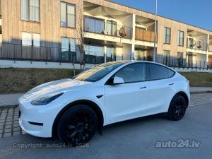 White Tesla Model Y 2023 in Tallinn, with an engine capacity of 0.00 L and mileage of 94 thousand km for 33900 €, photo 5 on AUTOMOTO.COM.LV