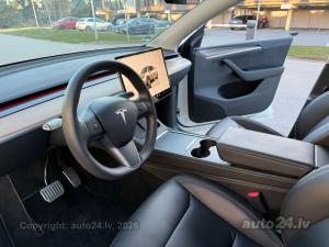 White Tesla Model Y 2023 in Tallinn, with an engine capacity of 0.00 L and mileage of 94 thousand km for 33900 €, photo 12 on AUTOMOTO.COM.LV