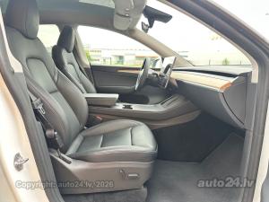 White Tesla Model Y 2023 in Tallinn, with an engine capacity of 0.00 L and mileage of 99 thousand km for 33700 €, photo 8 on AUTOMOTO.COM.LV