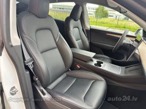 White Tesla Model Y 2023 in Tallinn, with an engine capacity of 0.00 L and mileage of 99 thousand km for 33700 €, photo 9 on AUTOMOTO.COM.LV